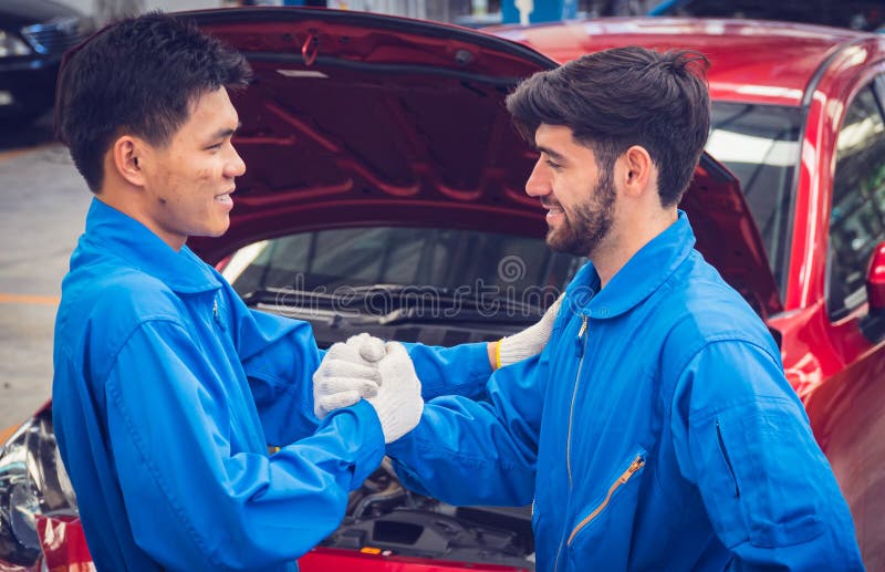 Mechanics Working in the Workshop Garage. Team Work Concepts Stock ...