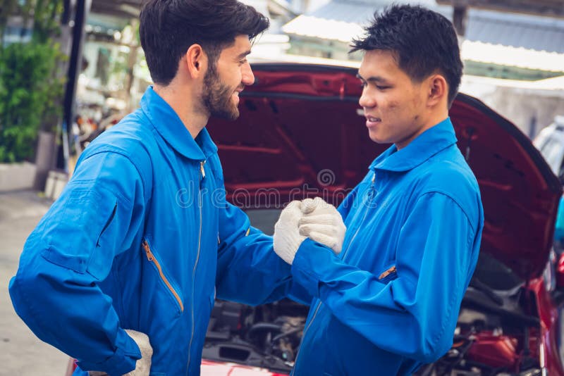 Mechanics Working in the Workshop Garage. Team Work Concepts Stock ...
