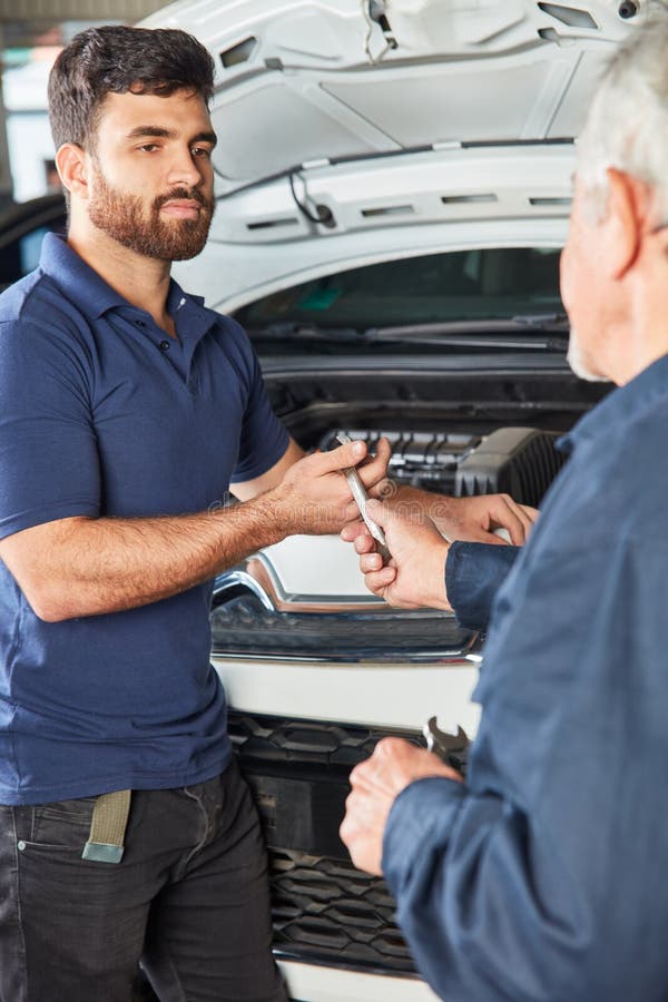 Mechatronics Engineer is Repairing Under the Car Stock Photo - Image of ...