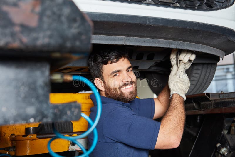Mechatronics Apprentice at the Auto Repair Stock Image - Image of ramp ...