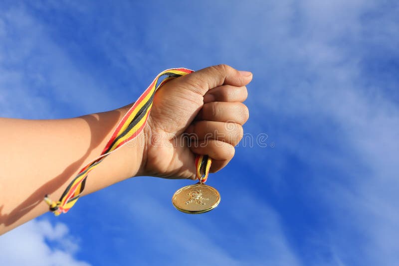 Medal and hand stock image. Image of golden, still, champion - 15451193