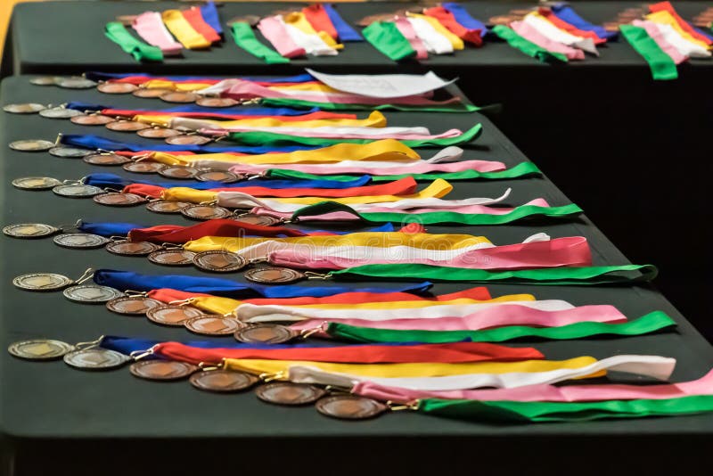 Medals on a table stock photo. Image of gold, ceremony - 143390808