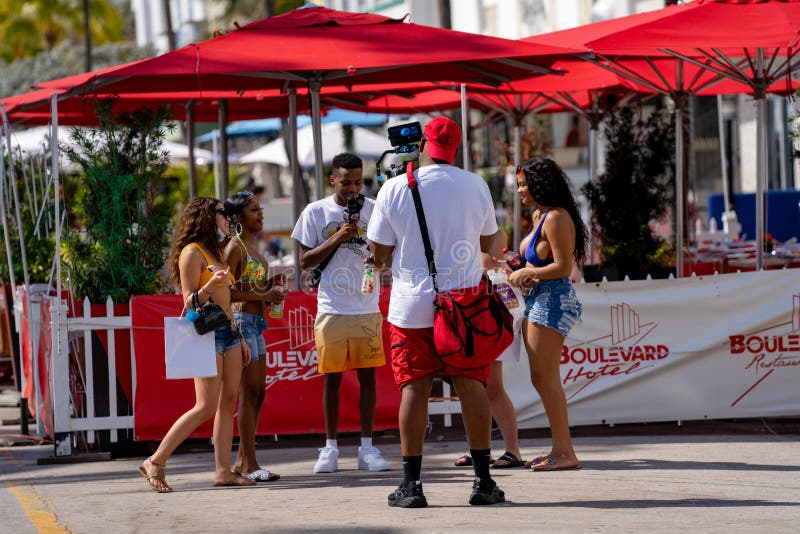 Media Vlogging in Miami Beach with Cameraman Interviewing Editorial ...