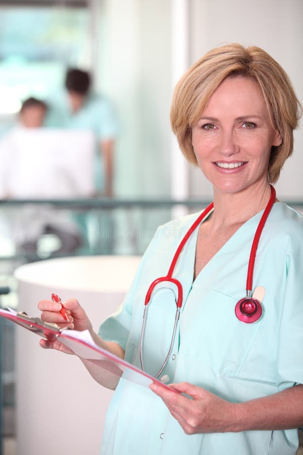 Mid Age Female Doctor Writing Prescription Stock Photo - Image of ...
