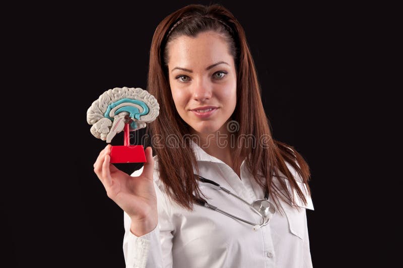 Medic Woman Holding a Human Brain Model Against Black Background Stock ...