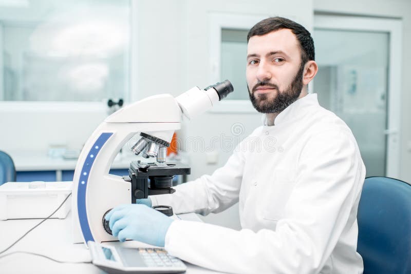 Medic Working with Microscope at the Laboratory Stock Image - Image of ...