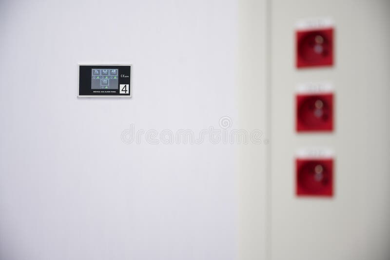 Medical Alarm Panel and Electrical Outlets on a White Wall Stock Photo ...