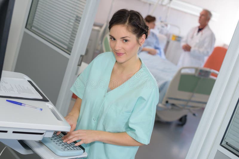 Medical Assistant on Phone, Using Computer Stock Photo - Image of ...