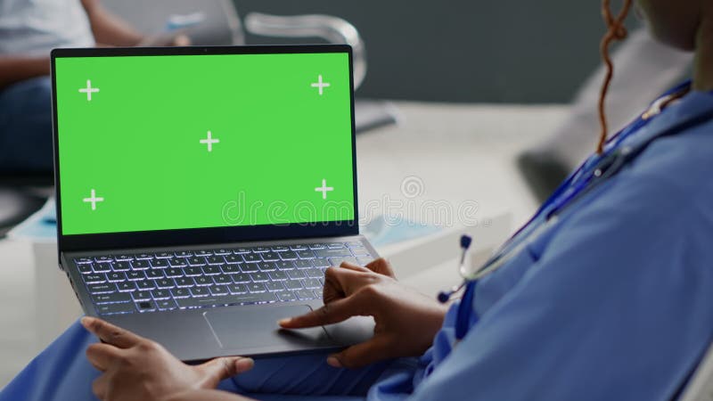 Medical Assistant Looking at Wireless Pc with Greenscreen Stock Video ...