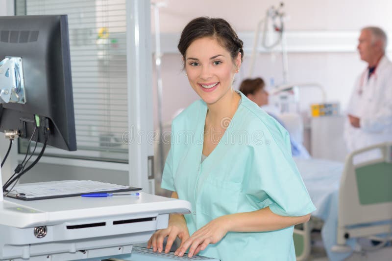 Medical Assistant Typing in Computer Stock Photo - Image of discharge ...