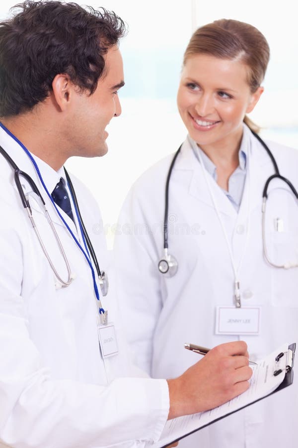 Medical Assistants with Patient Record Stock Photo - Image of 2529 ...