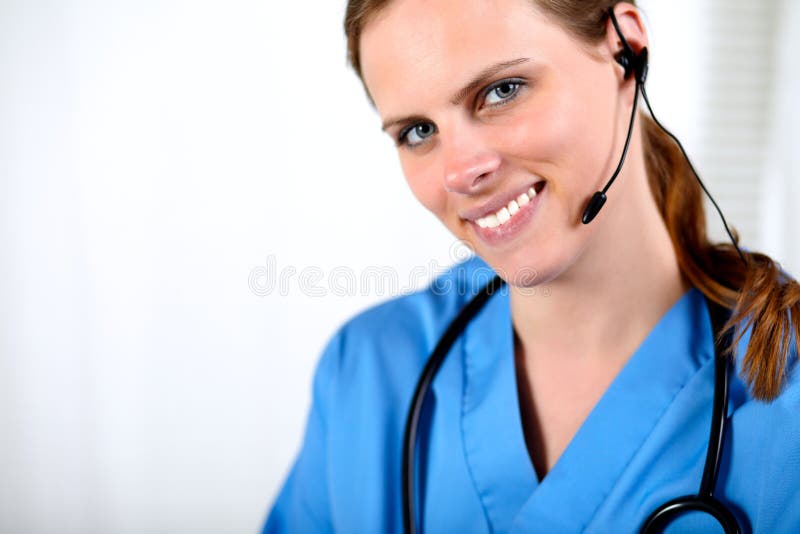 Medical Callcenter Operator Female Smiling Stock Photo - Image of blond ...