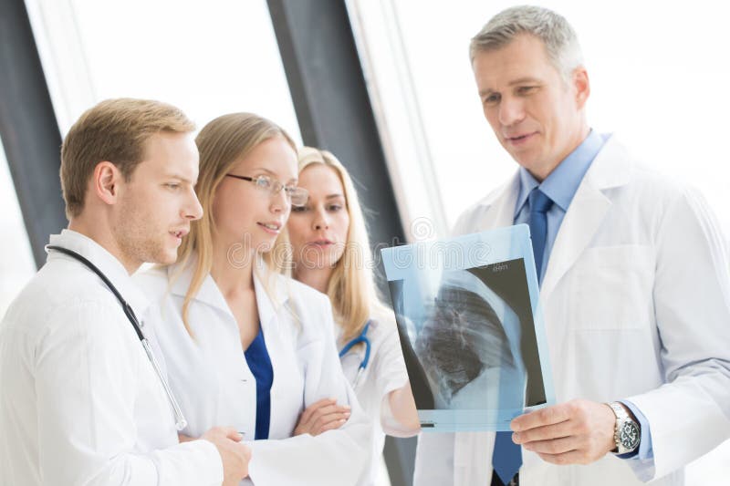 Medical Colleagues Discuss X-ray Stock Image - Image of hospital ...
