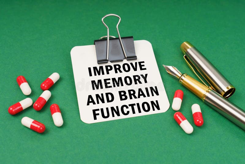 On the Green Surface of the Tablet, a Pen and a Notepad with the ...