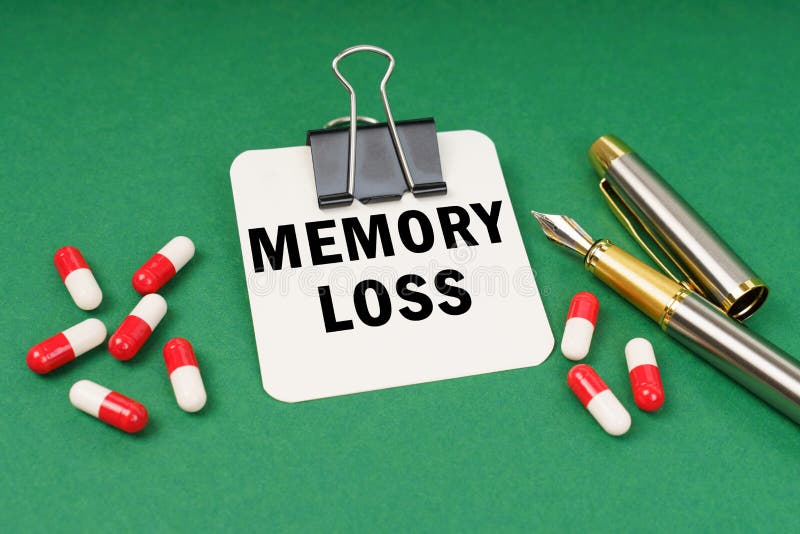 On the Green Surface of the Tablet, a Pen and a Notepad with the ...