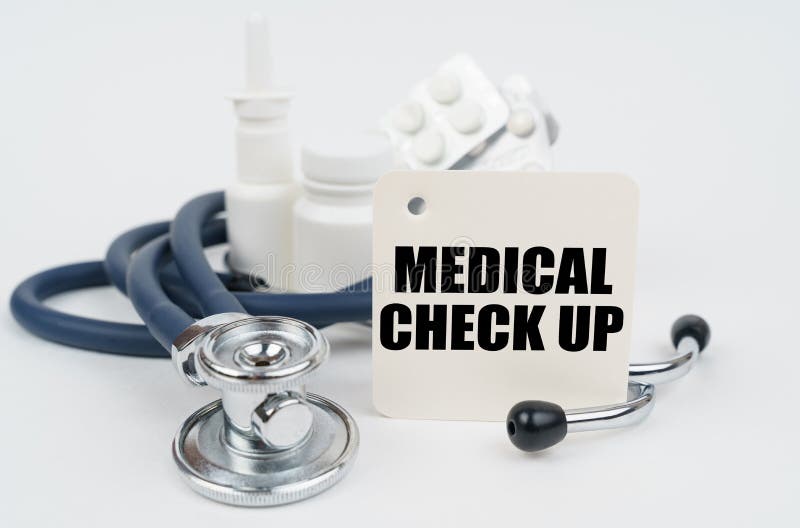 On a White Surface, Medicines, a Stethoscope and Writing Paper with the ...