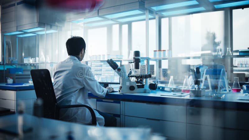 Medical Development Laboratory: Back View of Japanese Male Scientist ...