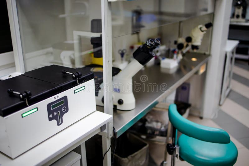 Microscope and Other Equipment. Specialists Working on Medicine ...