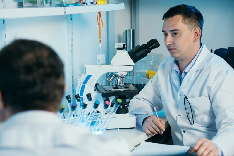 Medical Development Laboratory: Scientist Wearing Face Mask Looking ...