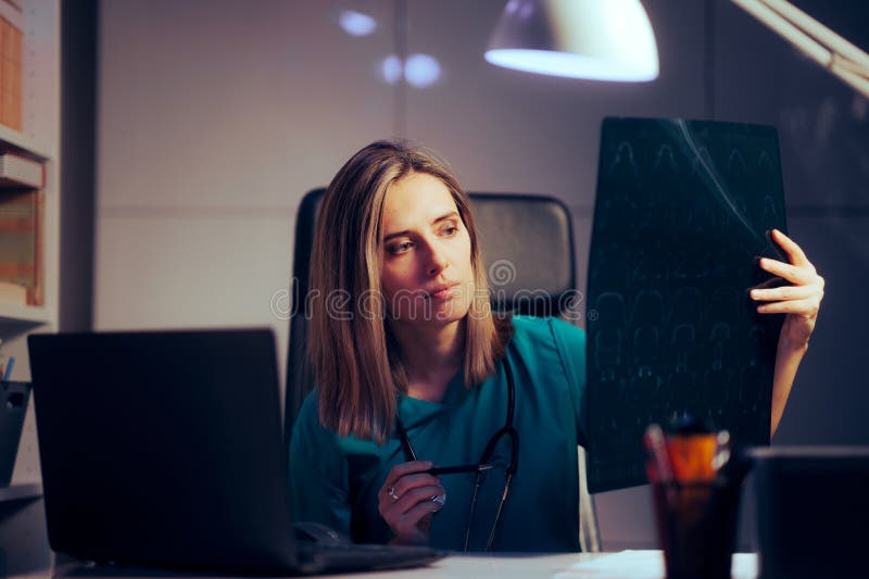 Medical Doctor Checking a CT Scan Result at Work Stock Photo - Image of ...