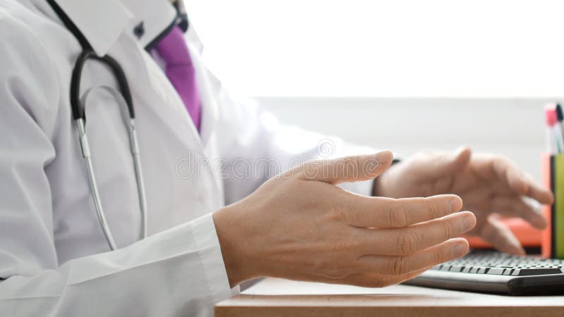 A Doctor Explaining Something by Making Hands Gestures Stock Photo ...