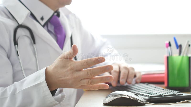 A Doctor Explaining Something by Making Hands Gestures Stock Photo ...