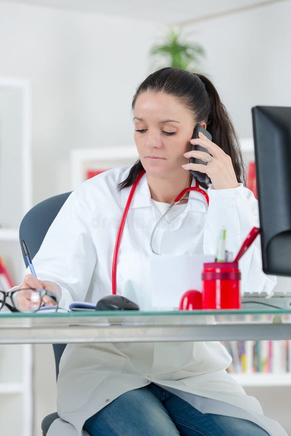 Medical Doctor on Phone in Office Stock Photo - Image of working ...