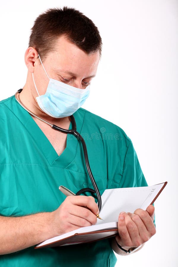 Medical Doctor With Stethoscope Writing Stock Image - Image of intern ...