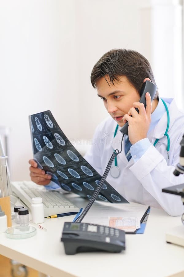 Medical Doctor with Tomography Speaking Phone Stock Image - Image of ...