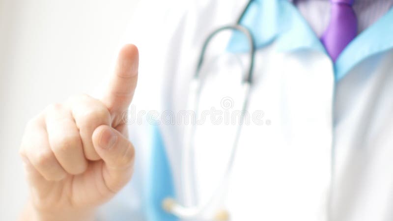 Medical Doctor Using One Finger for Pressing Virtual Touch Screen Stock ...