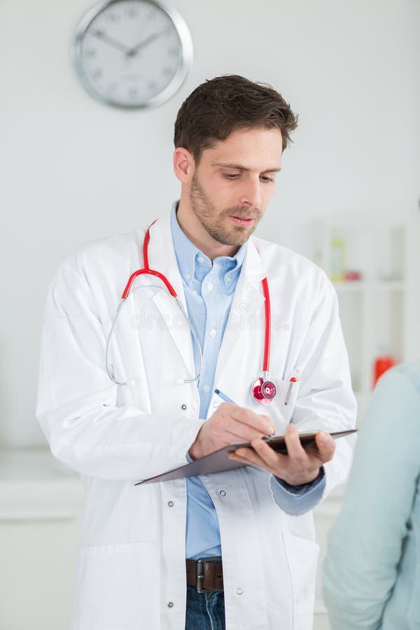 Medical Doctor Writing Prescription Stock Image - Image of young ...