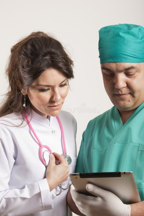 Medical Doctors Looking at Tablet Stock Photo - Image of medical, care ...