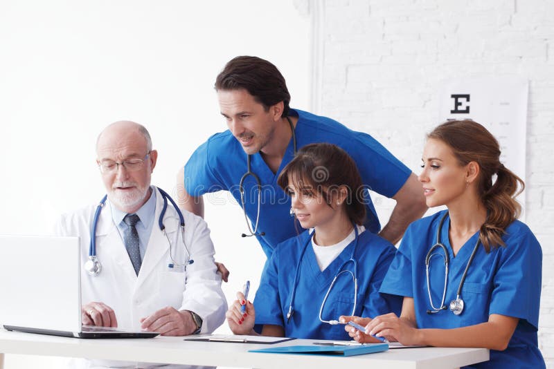Medical Doctors Team Using Computer Stock Photo - Image of looking ...