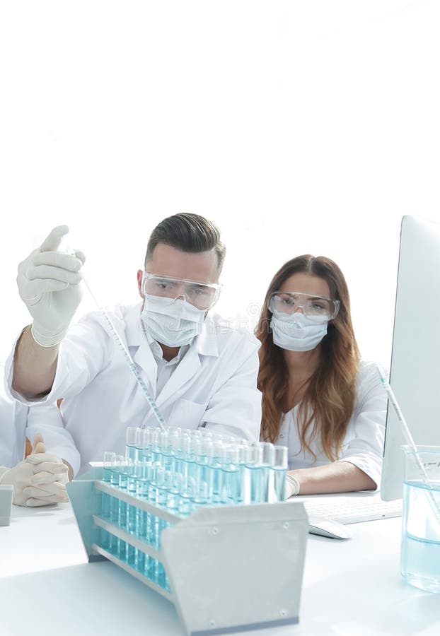 Medical Doctors are Working with Test Tubes and Microscope at the Lab ...