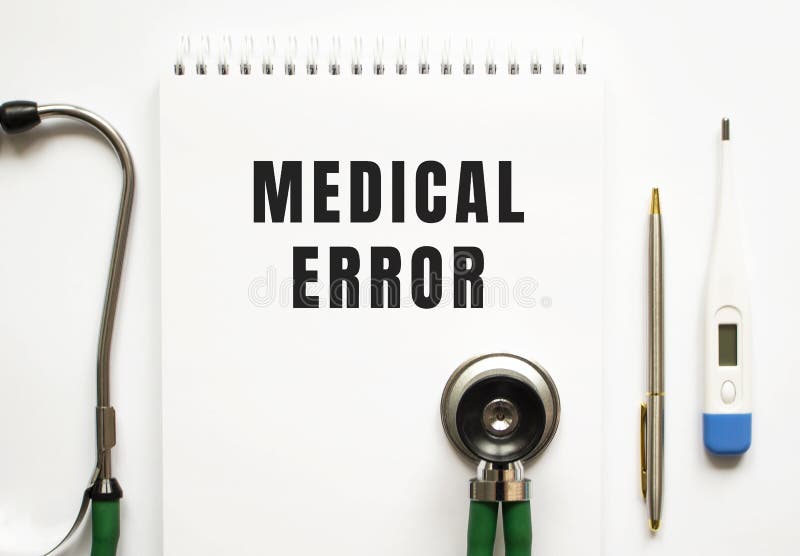 MEDICAL ERROR Text Written in a Notebook Lying on a Desk and a ...