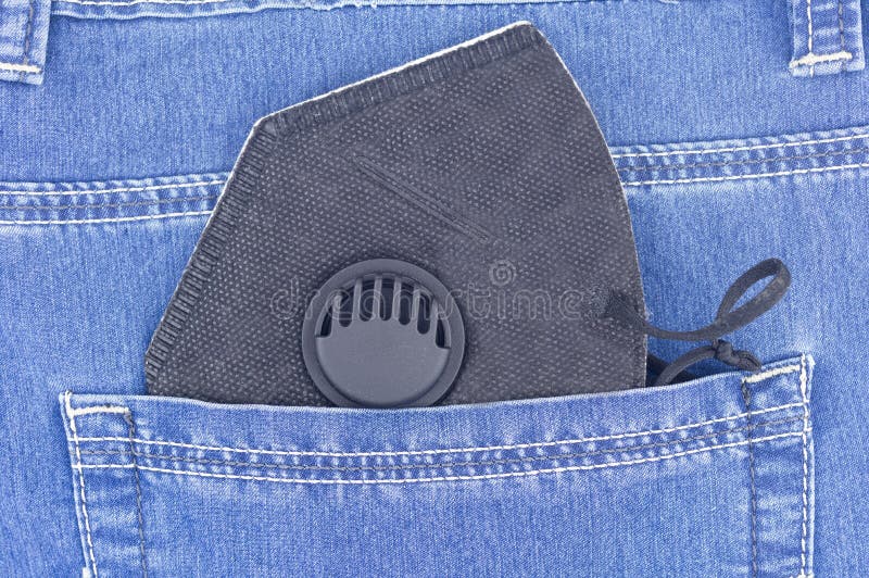 Medical Face Mask in Blue Jeans Pocket Stock Photo - Image of jeans ...