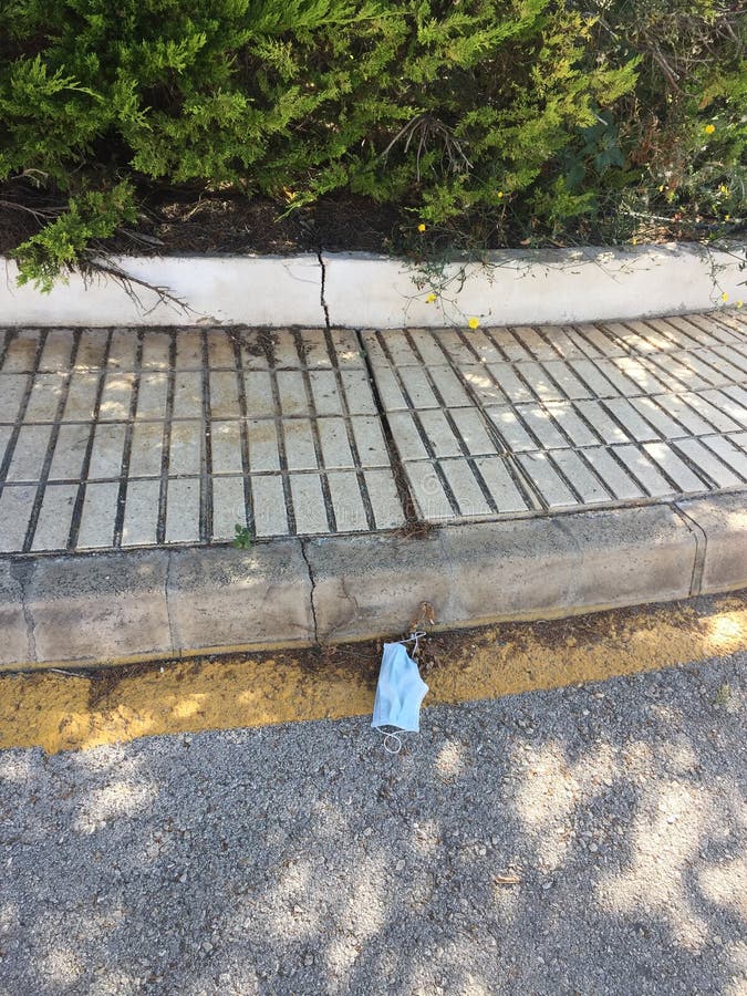 Medical Face Mask on the Floor in the Street Stock Photo - Image of ...