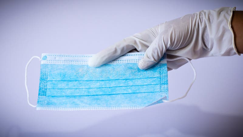 Medical Face Mask Holding in Gloved Single Hand Stock Image - Image of ...