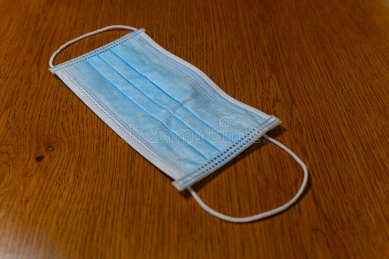 Medical Face Mask Isolated on Wooden Table Stock Photo - Image of ...