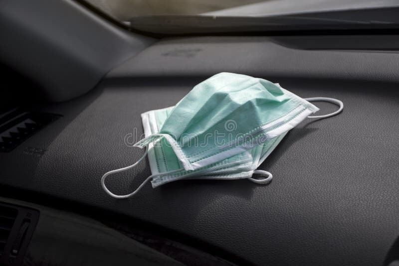 Medical Face Mask Placed on Front Console Stock Image - Image of ...