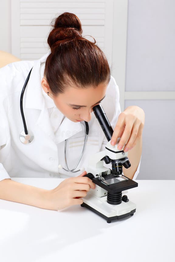 Medical - Female Nurse Looking in Microscope Stock Image - Image of ...