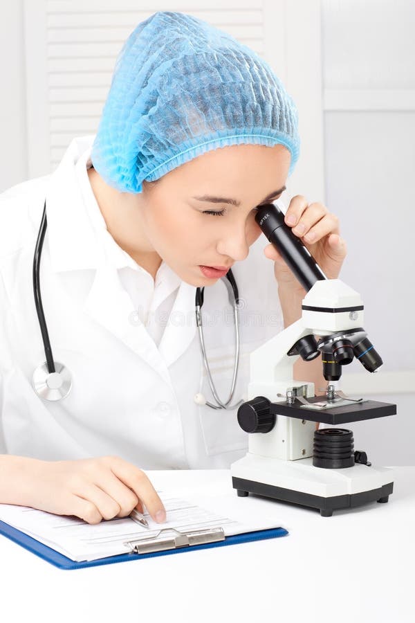 Medical - Female Nurse Looking In Microscope Stock Photo - Image of ...