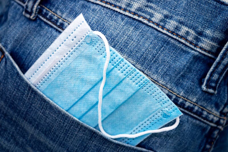Medical Mask in the Back Pocket of Jeans. Blue Medical Mask in a Denim ...