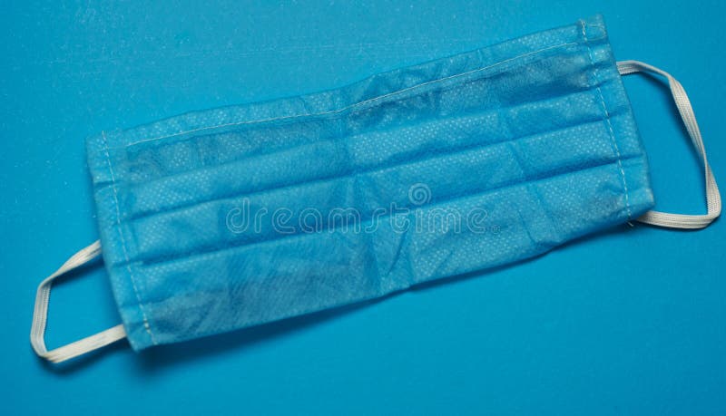 Medical Mask on a Blue Background Stock Image - Image of pollution ...