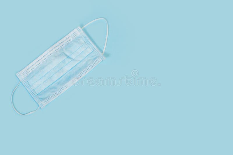 Medical Mask on a Blue Background Stock Photo - Image of preventative ...