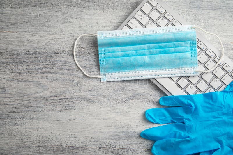 Medical Mask, Gloves and Computer Keyboard on the Table Stock Photo ...