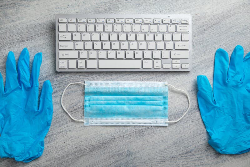 Medical Mask, Gloves and Computer Keyboard on the Table Stock Photo ...