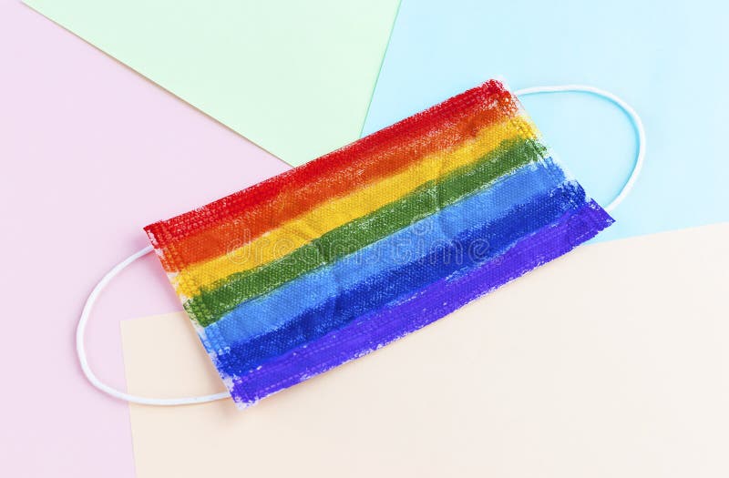 Medical Mask with a Rainbow Drawn on Multicolored Paper Stock Image ...
