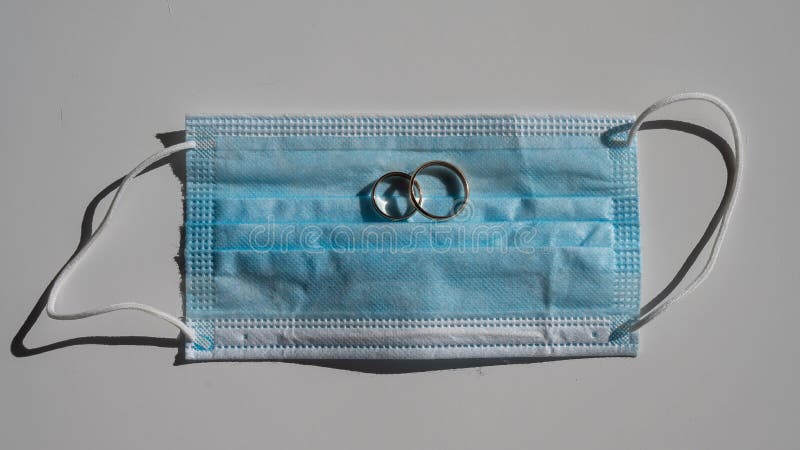 Medical Mask and Wedding Rings on White Table. Stock Image - Image of ...