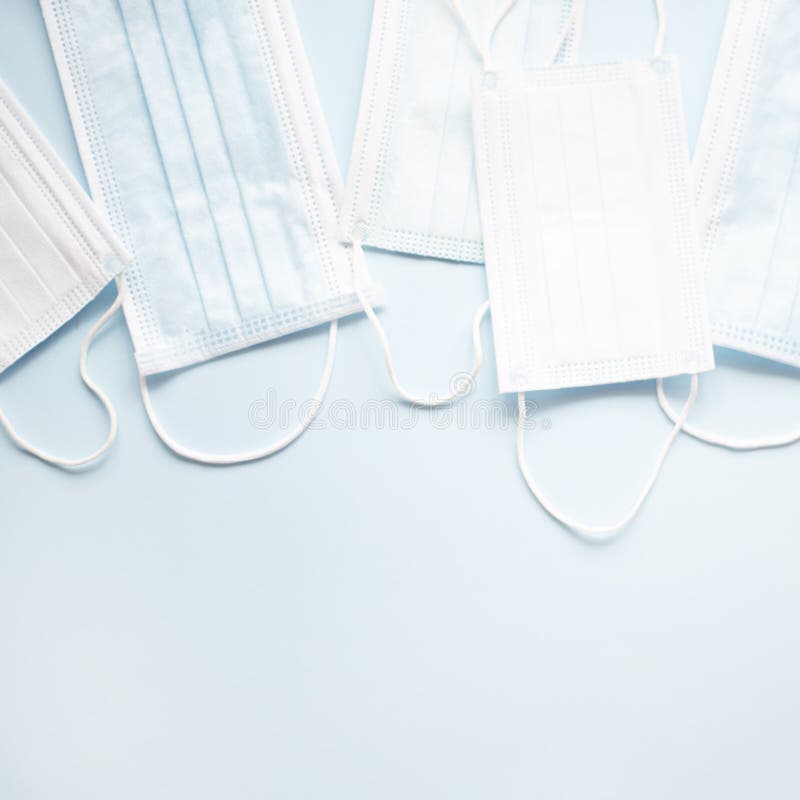 Medical Masks on a Light Blue Background Stock Photo - Image of news ...